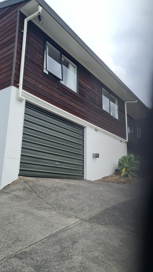 Cedar Stained Walls - Painted Eaves - Stained Balustrades. | Builderscrack