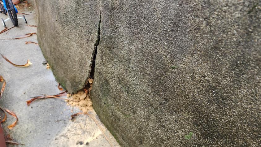 Retaining wall cracking large and moving due to water retention - Needs ...