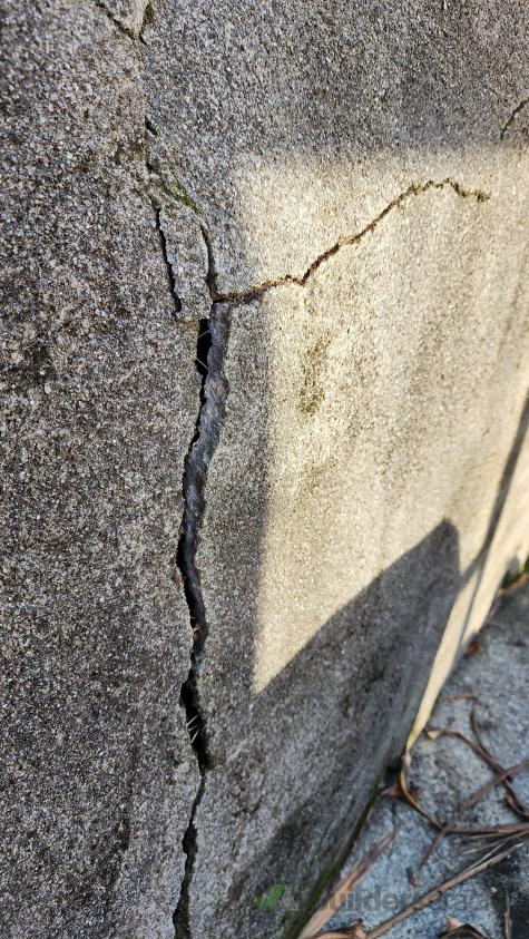 Retaining wall cracking large and moving due to water retention - Needs ...