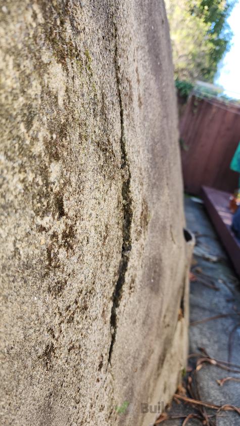 Retaining wall cracking large and moving due to water retention - Needs ...