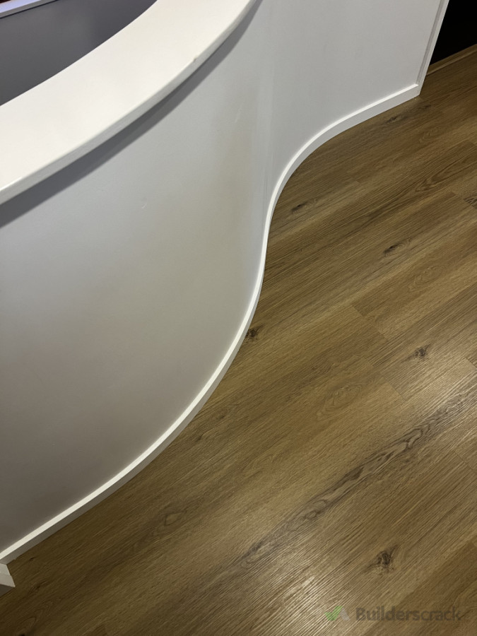 SPC flooring install with stairs and curved walls | Builderscrack