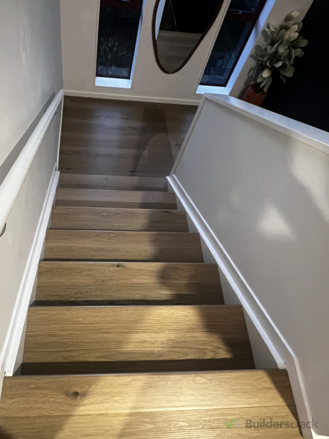 SPC flooring install with stairs and curved walls | Builderscrack