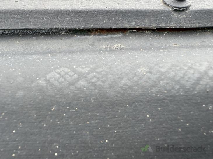 Roof is leaking into below room due to rust under flashing, leak is not ...