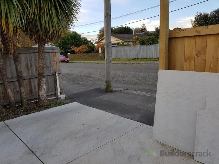 Sliding gate tracks bolted to concrete driveway (#271989) | Builderscrack