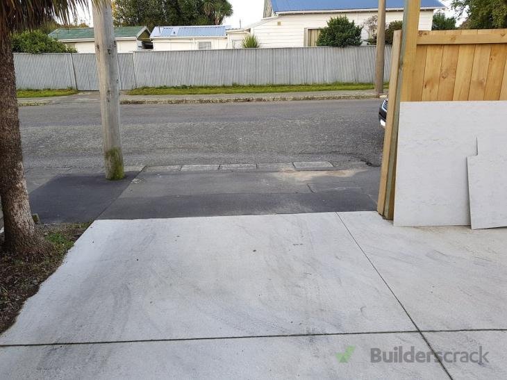 Sliding gate tracks bolted to concrete driveway (#271989) | Builderscrack