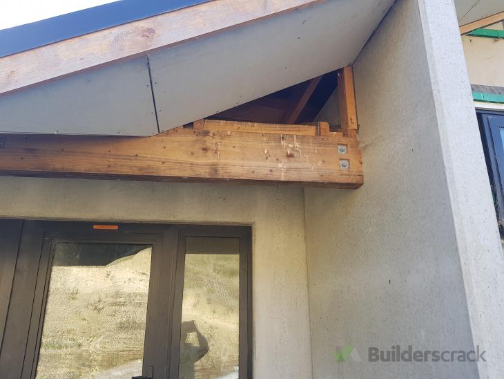 Completion of macrocarpa cladding + trim down 2 x wooden window sills ...